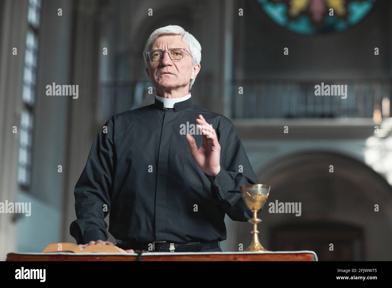 Smiling preacher bible in church hi-res stock photography and images ...