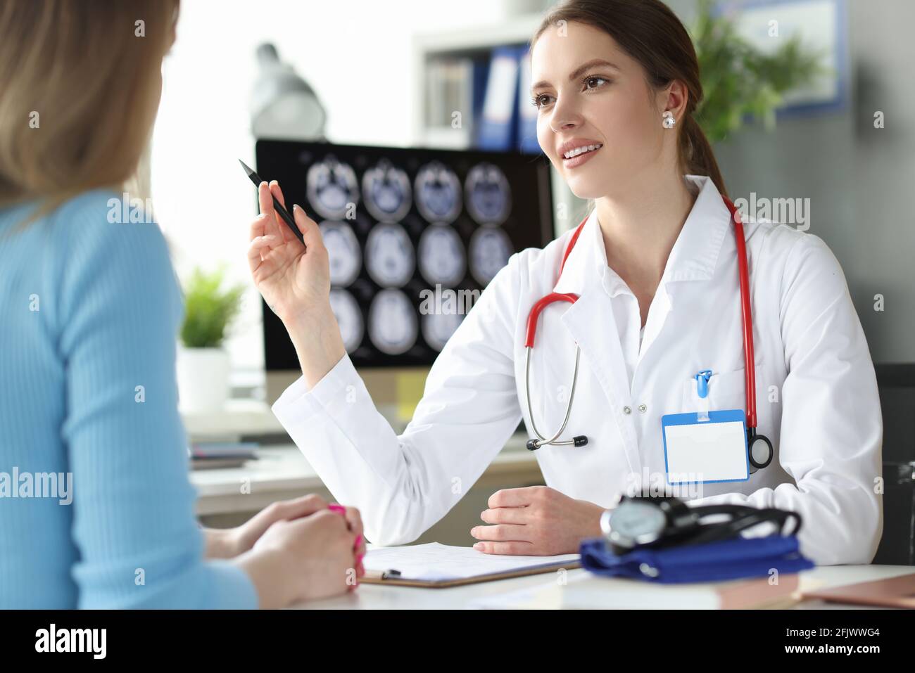 Female doctor consults patient on health issues Stock Photo - Alamy