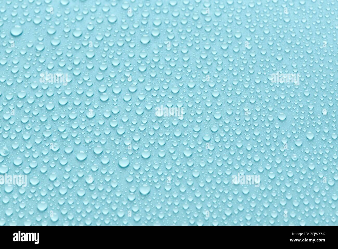 Pure water drops on light blue abstract background, droplets texture ...
