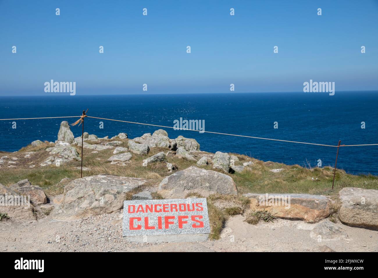 Dangerous Cliffs warning sign at Land's End in Cornwall, UK Stock Photo ...