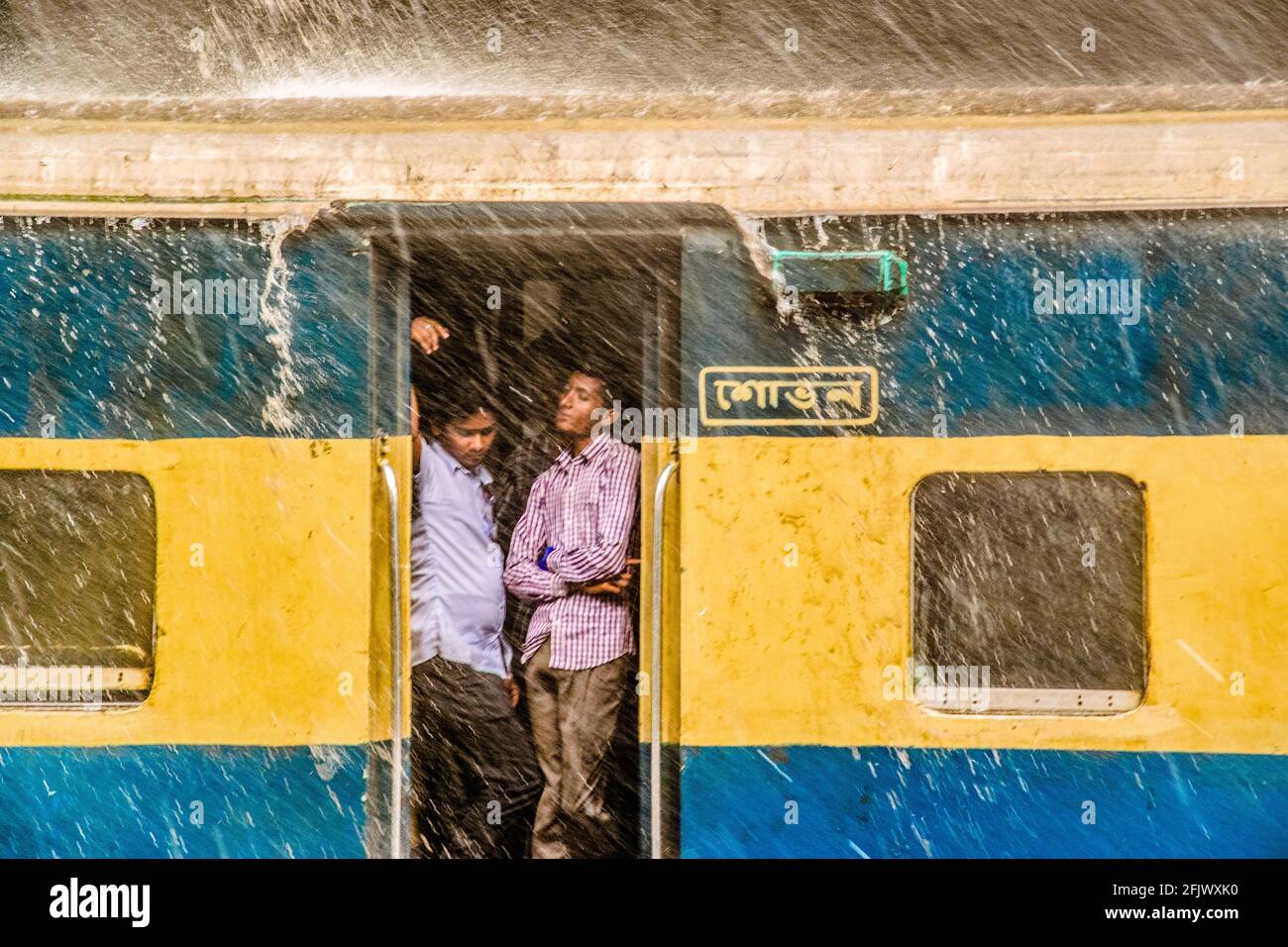 Enjoying the Sudden Rain in a running train in Kamlapur Railway Station ...