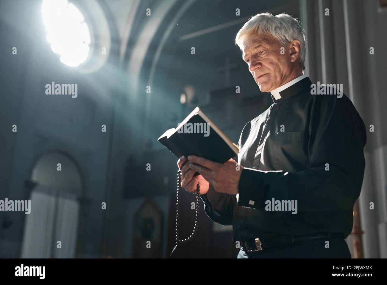 Smiling preacher bible in church hi-res stock photography and images ...