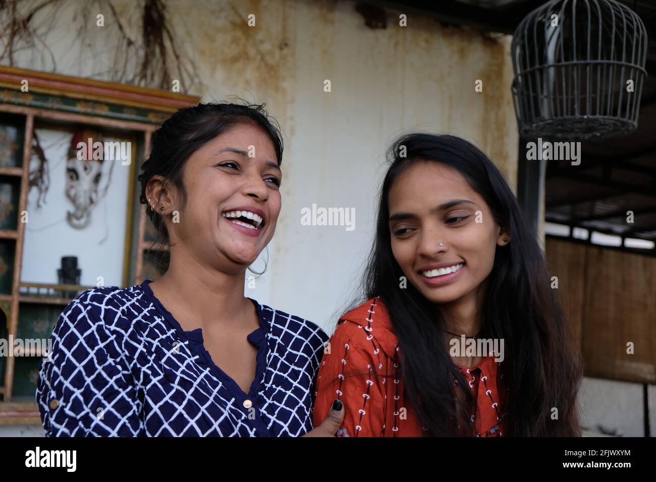 Portrait of two young laughing Indian females Stock Photo - Alamy