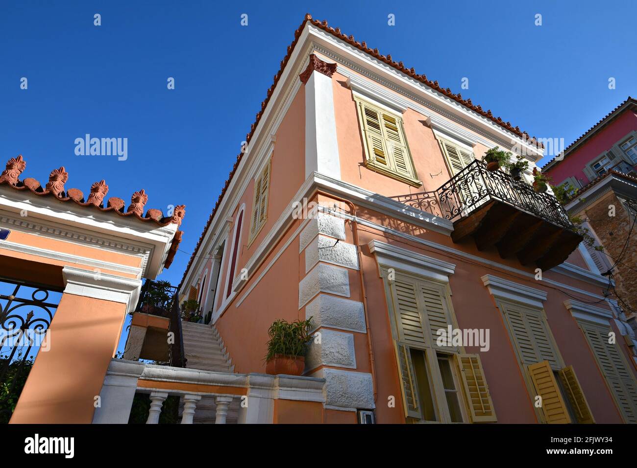 Neoclassical house exterior with Venetian stucco walls, white trim and ...