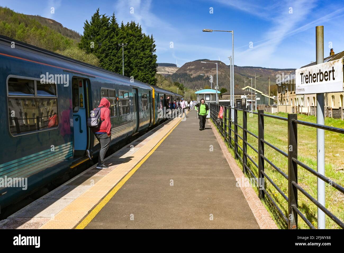 Treherbert, Rhondda Valley, Wales - April 2021: People getting off a ...