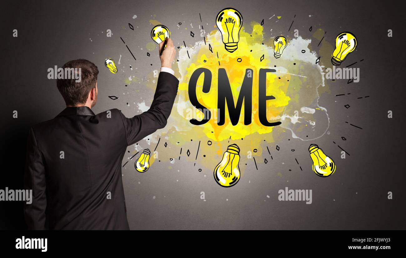 man drawing colorful light bulb Stock Photo - Alamy