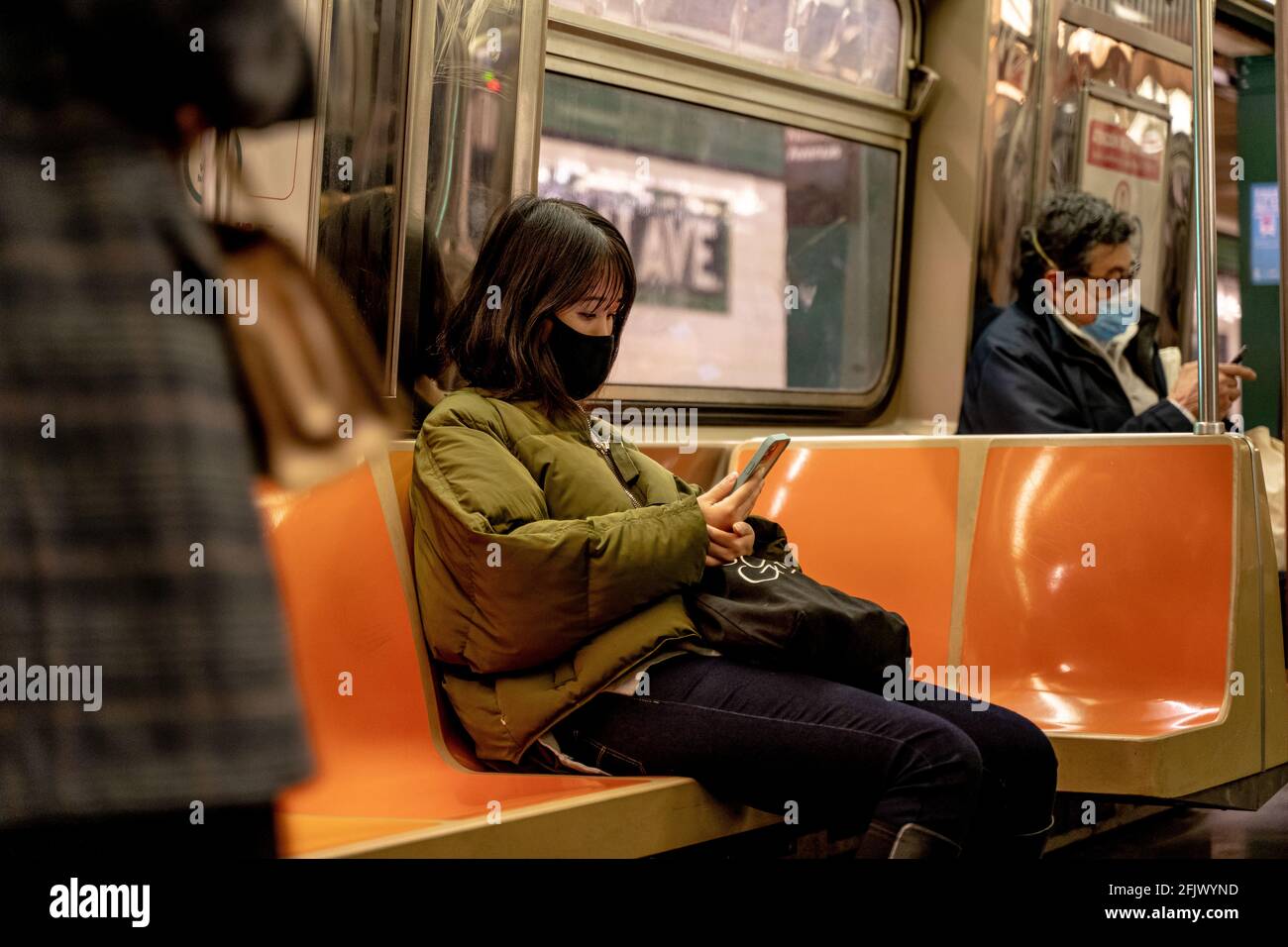 Girl sitting in the NYC Subway Stock Photo - Alamy