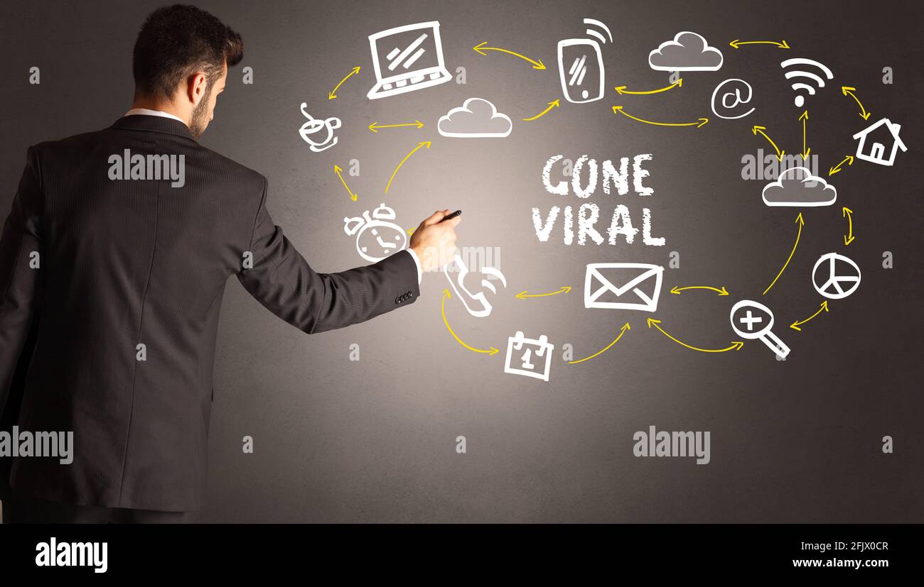 businessman drawing social media icons Stock Photo - Alamy