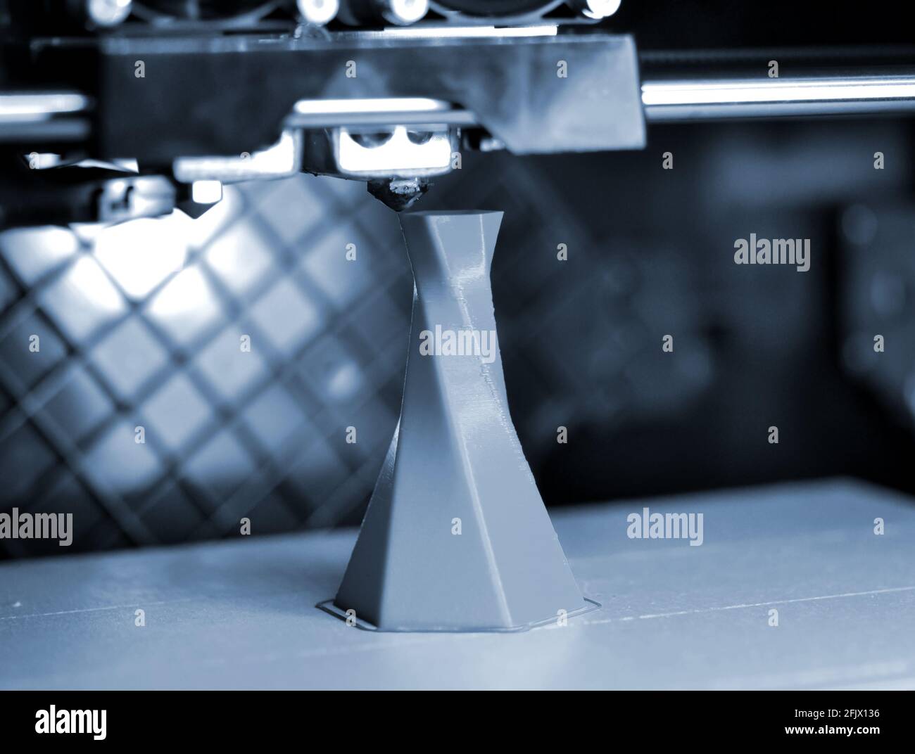 3D printer printing isolated volume triangular object blue gray color ...