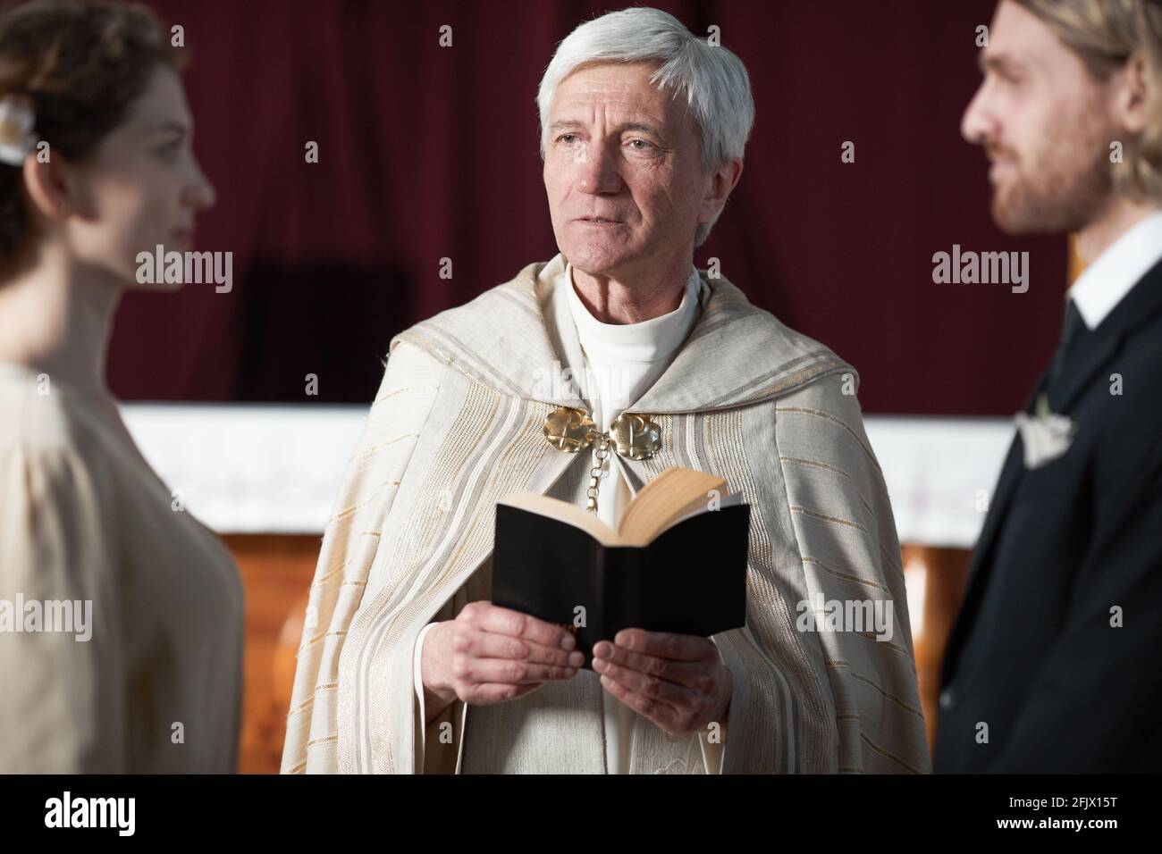 Smiling preacher bible in church hi-res stock photography and images ...