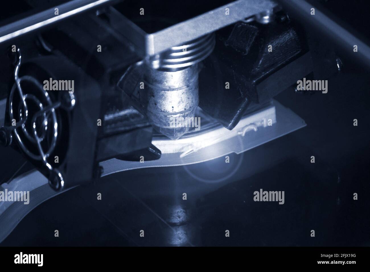 Printer printing gray objects on mirror reflective surface close-up top ...