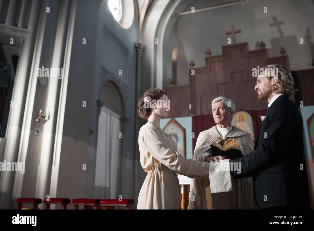 Smiling preacher bible in church hi-res stock photography and images ...