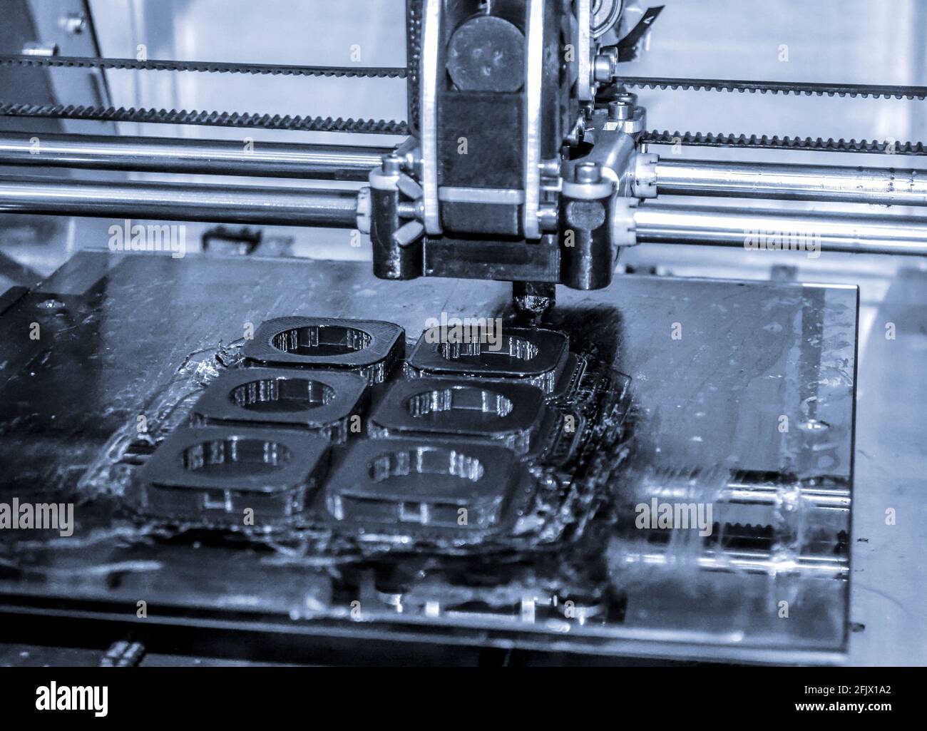 Modern 3D printer printing figure close-up. Automatic three dimensional ...