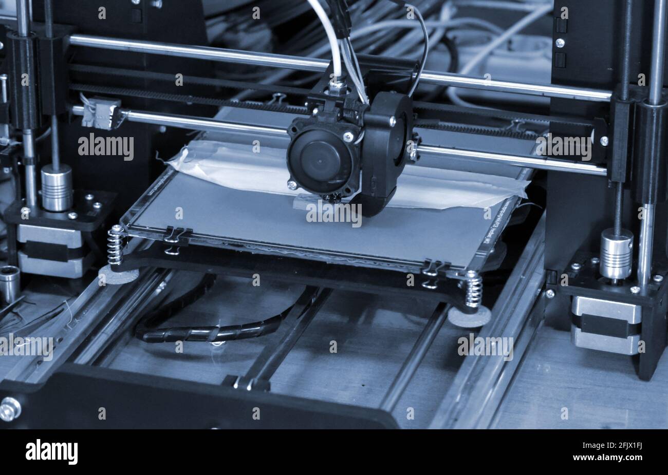 Modern 3D printer printing figure close-up. Automatic three dimensional ...