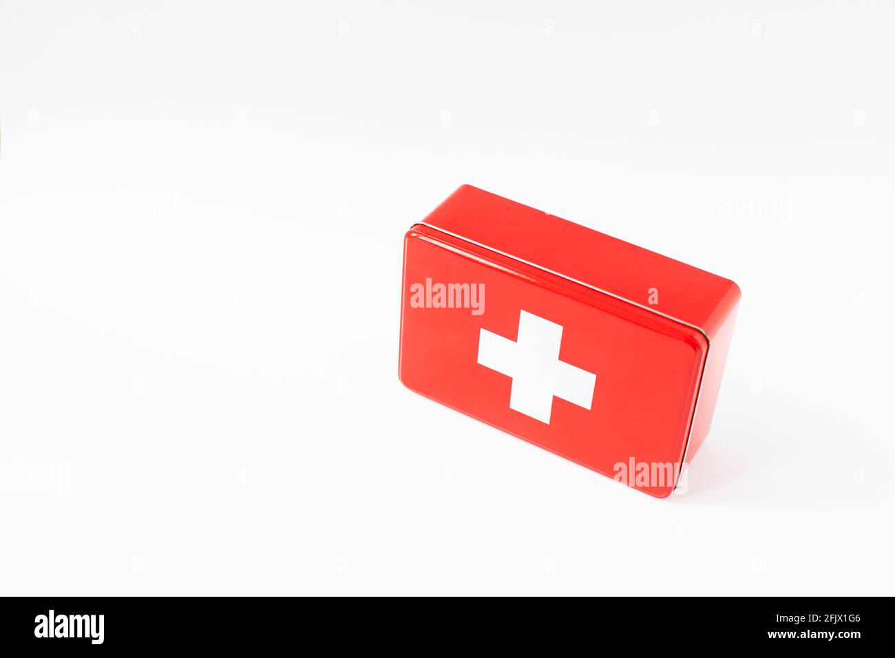 Red simplistic first aid box, white background, high key, horizontal ...