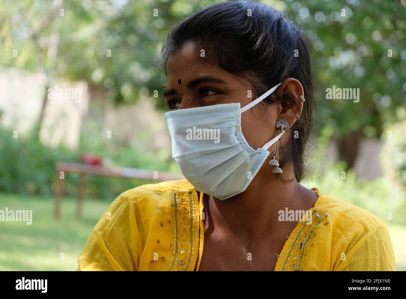 Portrait of a young Indian female in traditional clothes saree/sari and ...