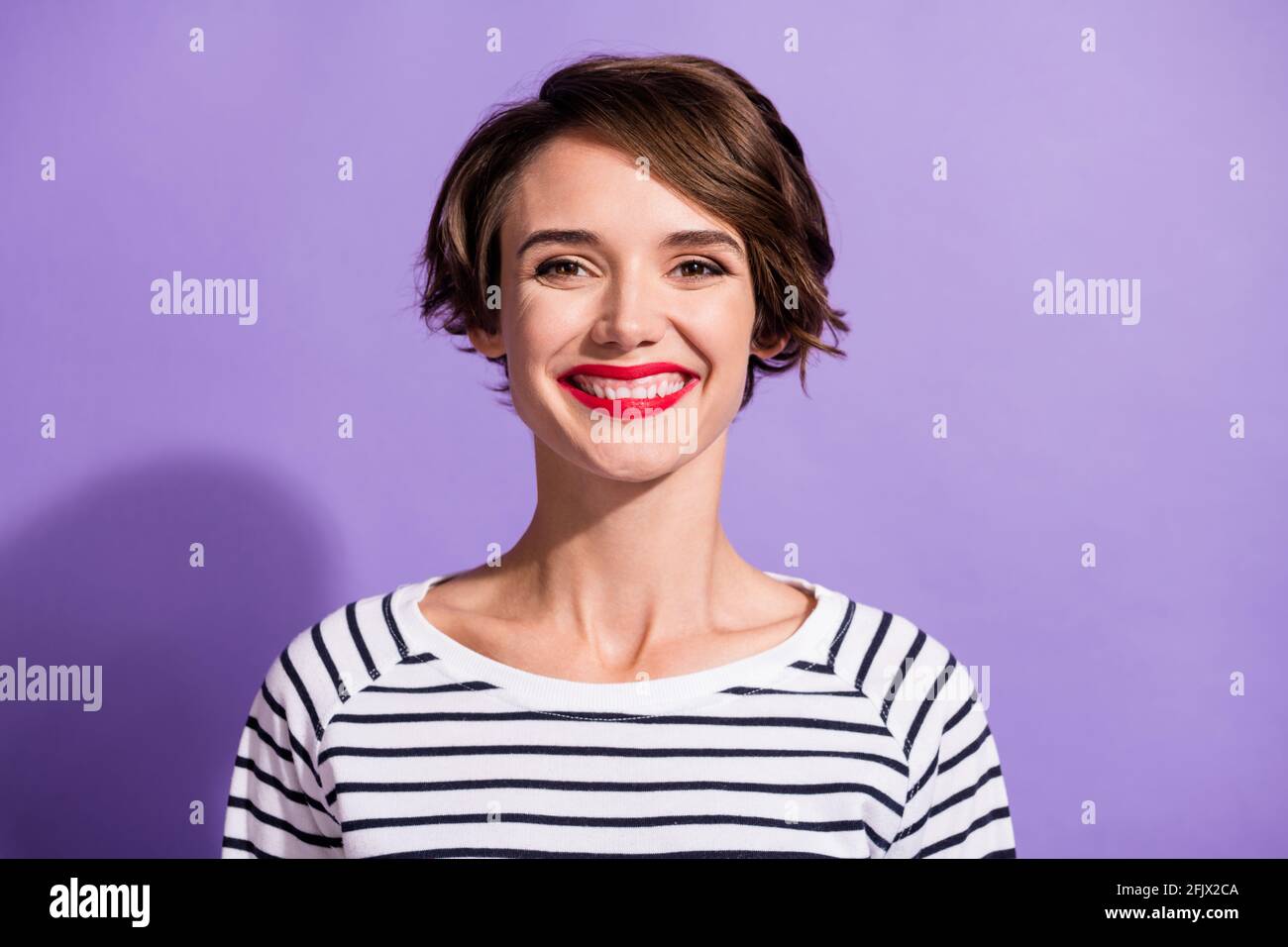 Portrait Of Cute Optimistic Short Brunette Hairdo Girl Wear Stripped