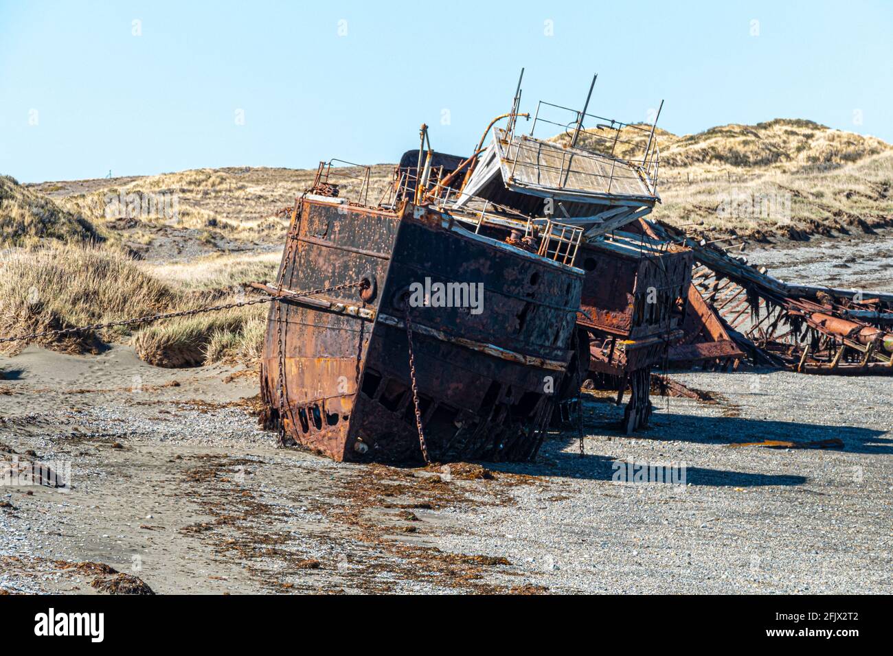 Wreckages, abandoned rusty stranded boat on San Gregorio beach in the ...