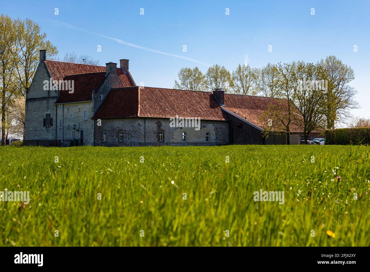 16th century farm building in a meadow. It is a typical carré farm ...