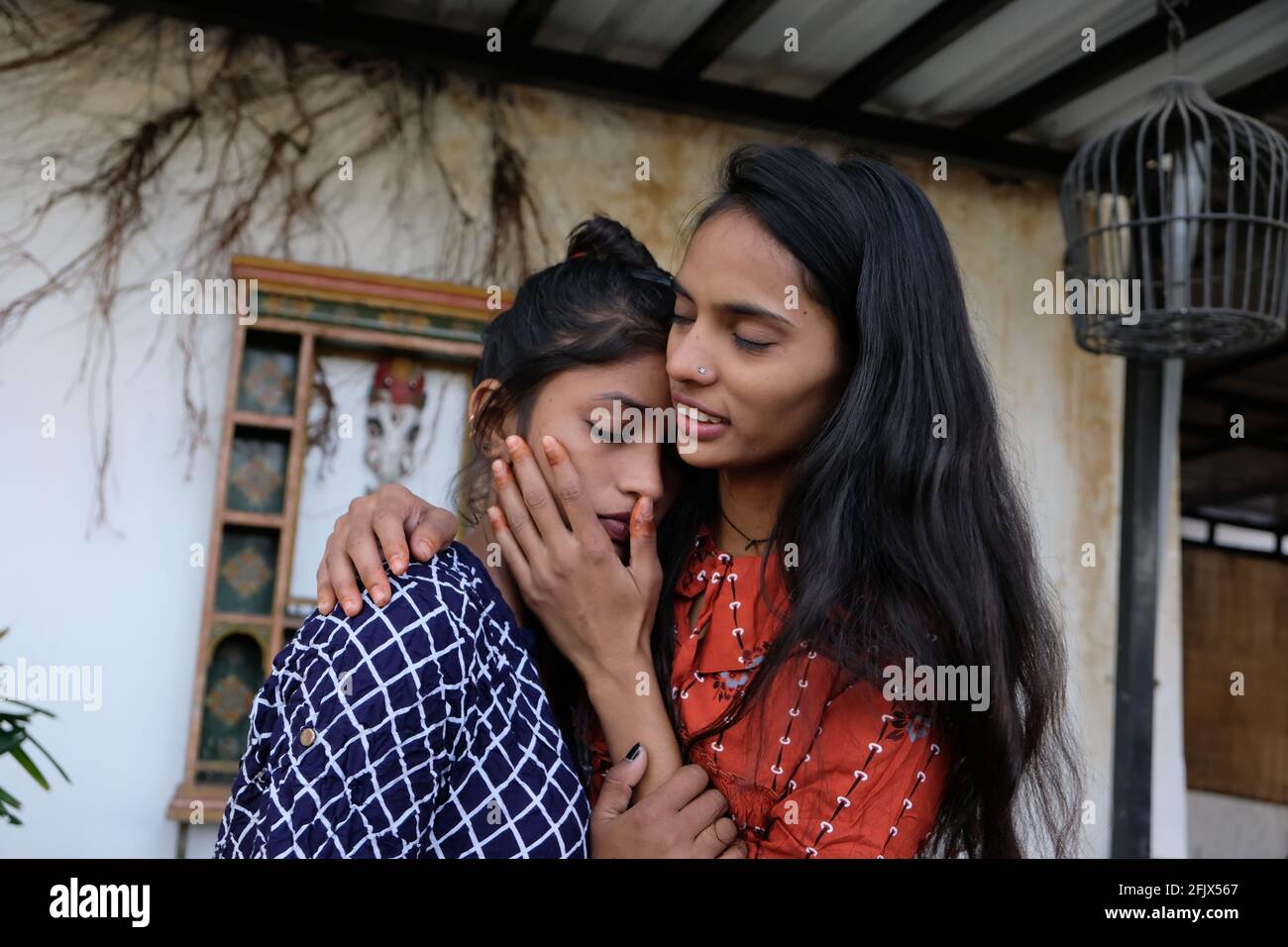 Indian female friends hugging and comforting each other Stock Photo - Alamy