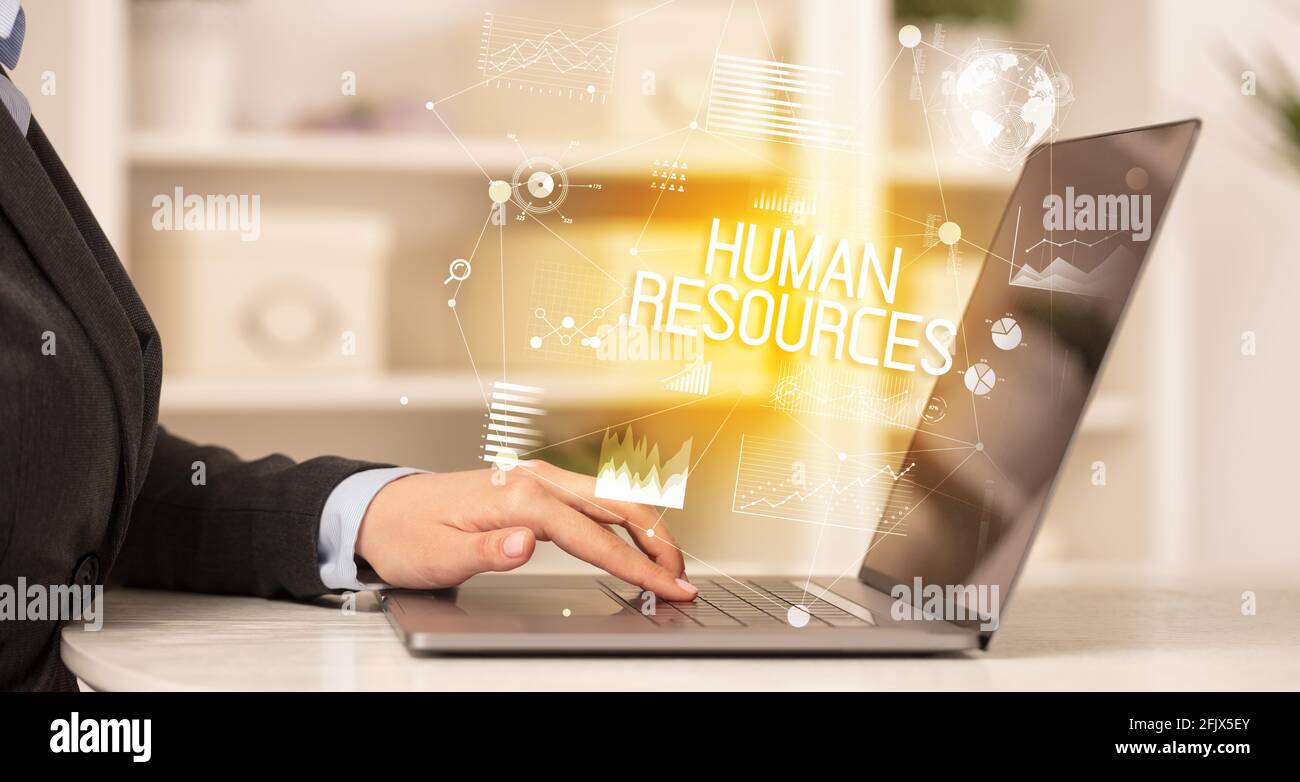 Side view of a business person working on laptop Stock Photo - Alamy