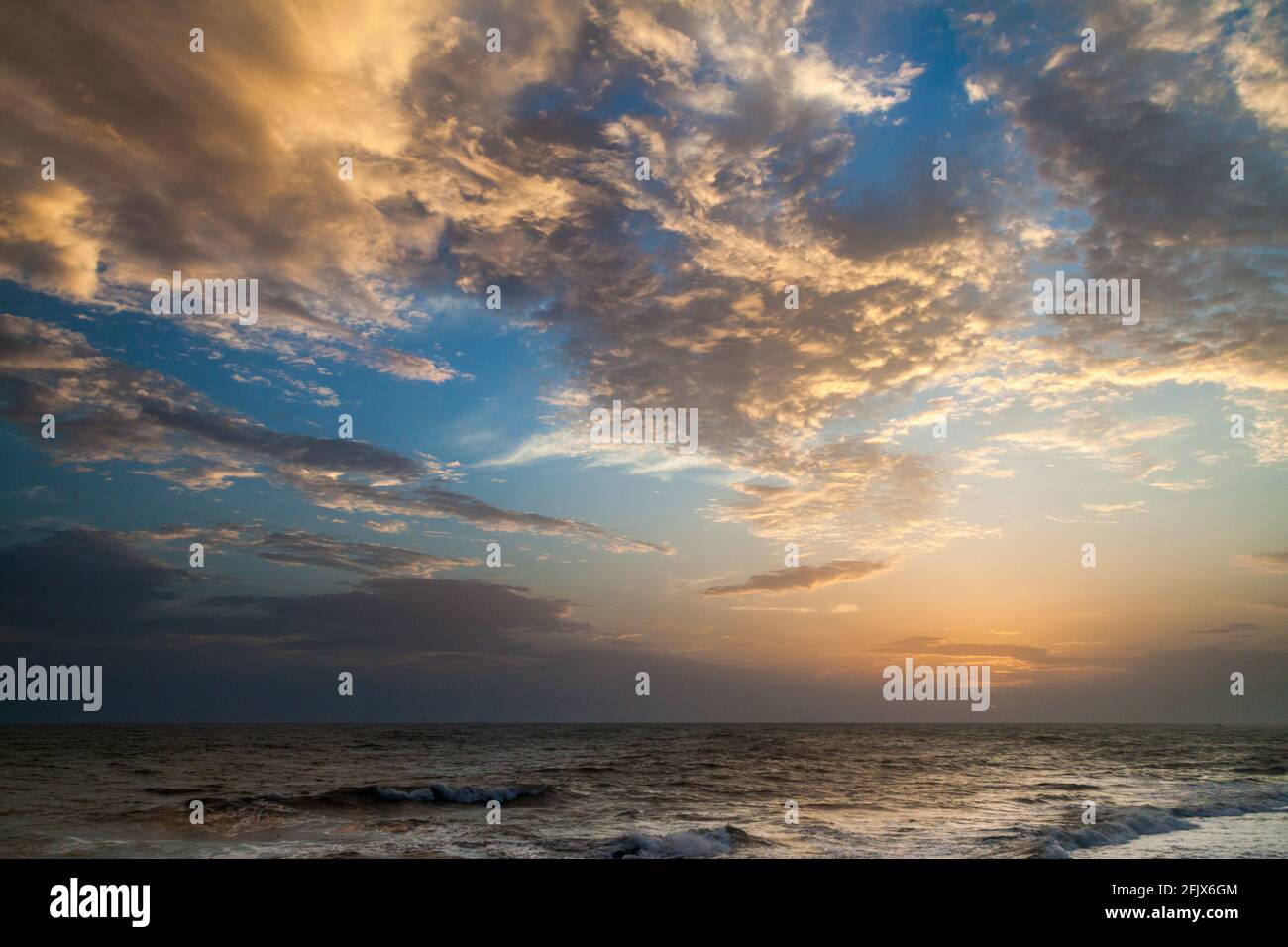 Beautiful sunset at the sea with dramatic sky hi-res stock photography ...
