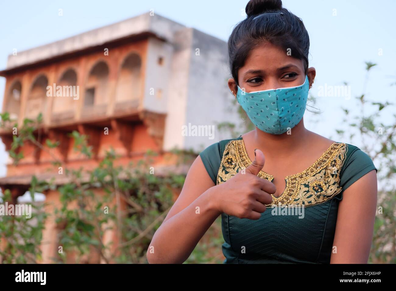 Closeup shot of a South Asian female in a traditional dress and a ...