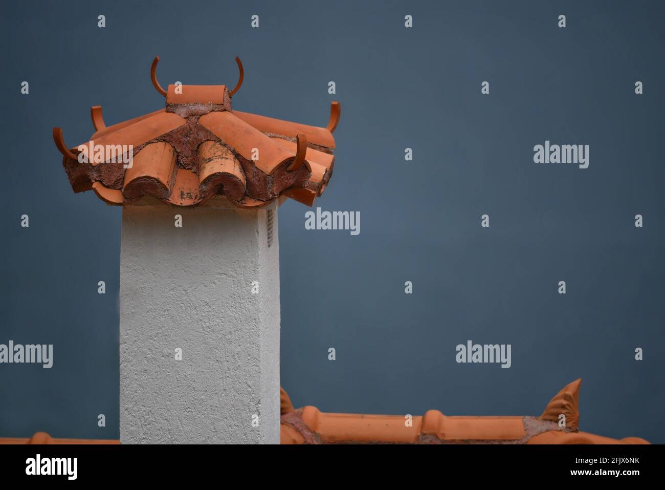 Traditional red clay tile chimney on a rural house in Tyros, Arcadia ...