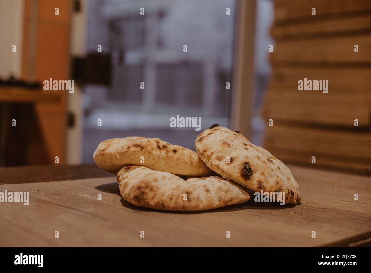 Closeup shot of newly baked bread on a table Stock Photo - Alamy