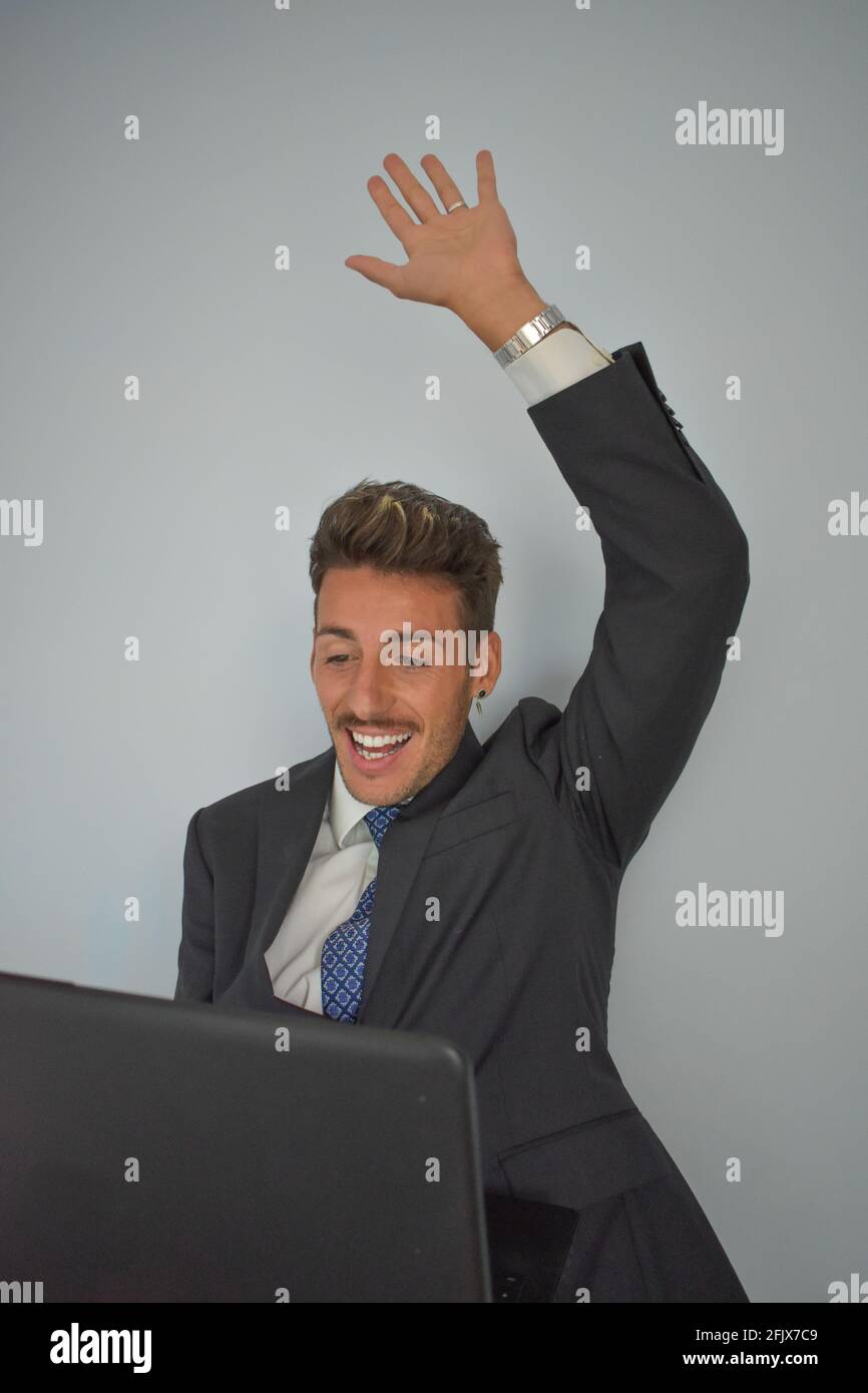 Businessman celebrating success on laptop hi-res stock photography and ...