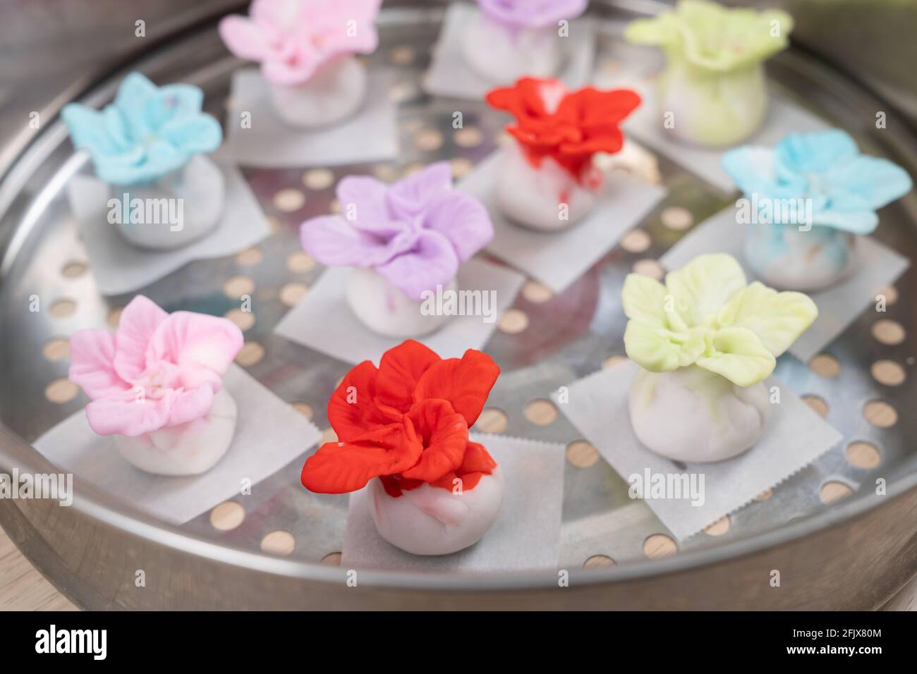 Chinese style colorful flower dumplings before steaming Stock Photo - Alamy
