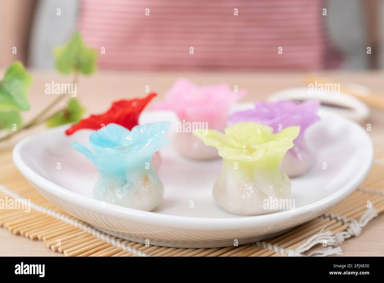 Chinese style colorful flower dumplings or dim sum Stock Photo - Alamy