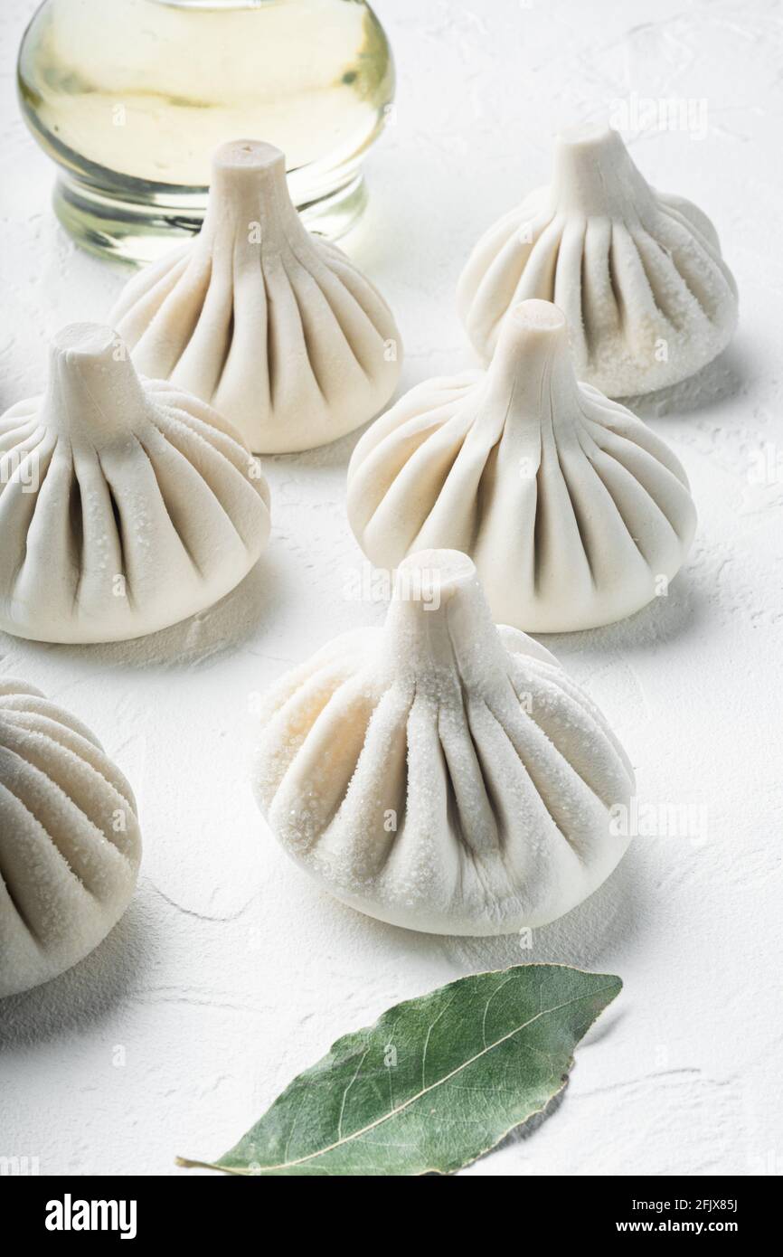 Homemade, traditional chinese pan fried dumplings set, on white stone ...