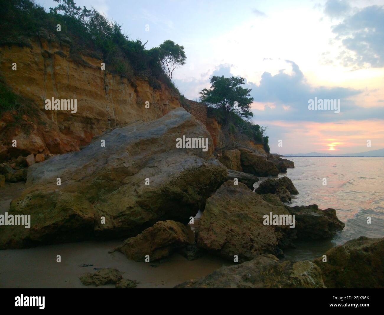 Beautiful shot of a cliff on background of pink toned sunset Stock ...