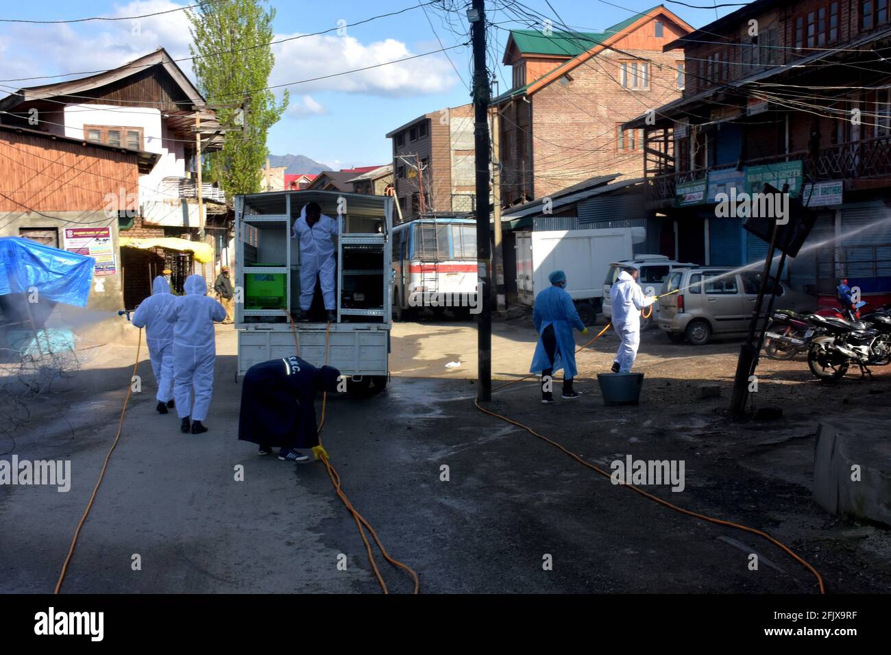 Srinagar, Jammu and kashmir India 07 August 2020. Kit wearing frontline warriors sanitizing ...