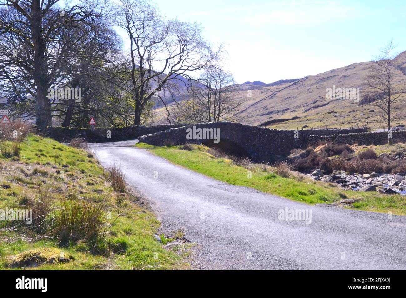 Road and bridge over the River Duddon, Harter Fell in background, at ...