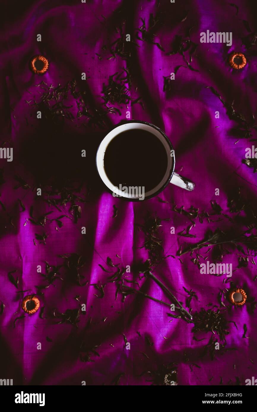 Coffee cup in violet background Stock Photo - Alamy