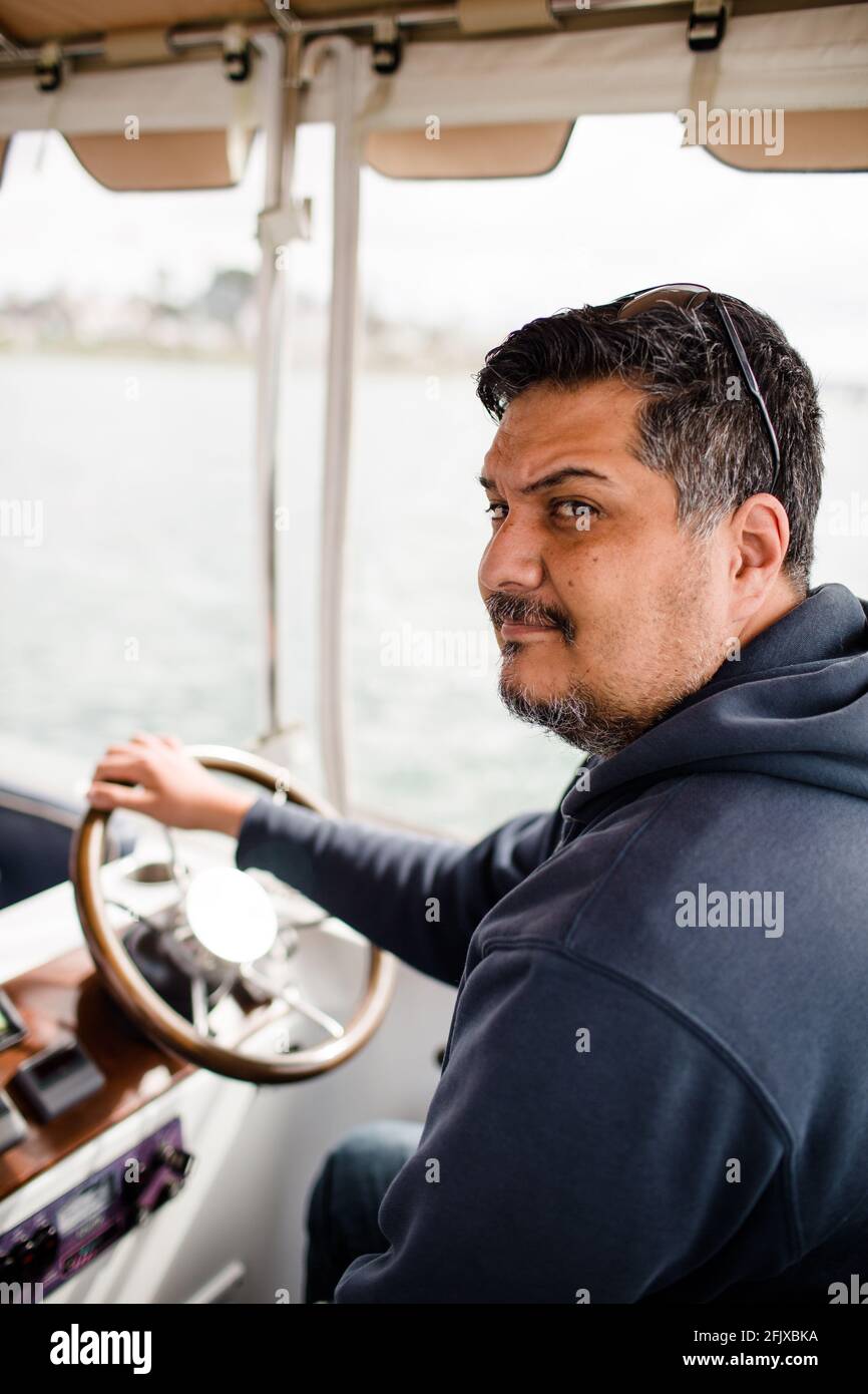 Driving boat on bay hi-res stock photography and images - Alamy