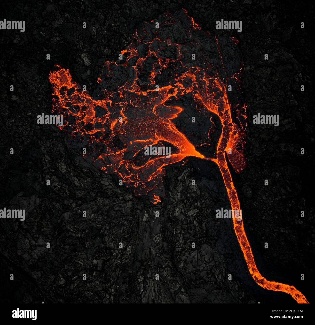 Flow of lava on rocky ground Stock Photo - Alamy