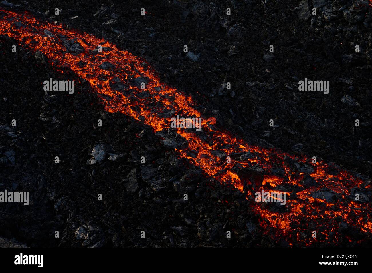 Igneous burning lava flowing on rough ground Stock Photo - Alamy