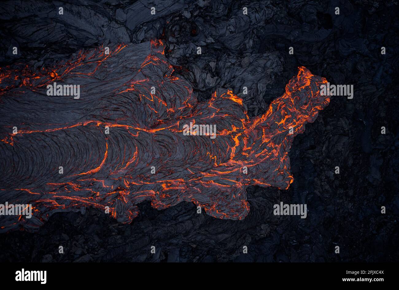 Volcanic lava flowing on rough slope Stock Photo - Alamy