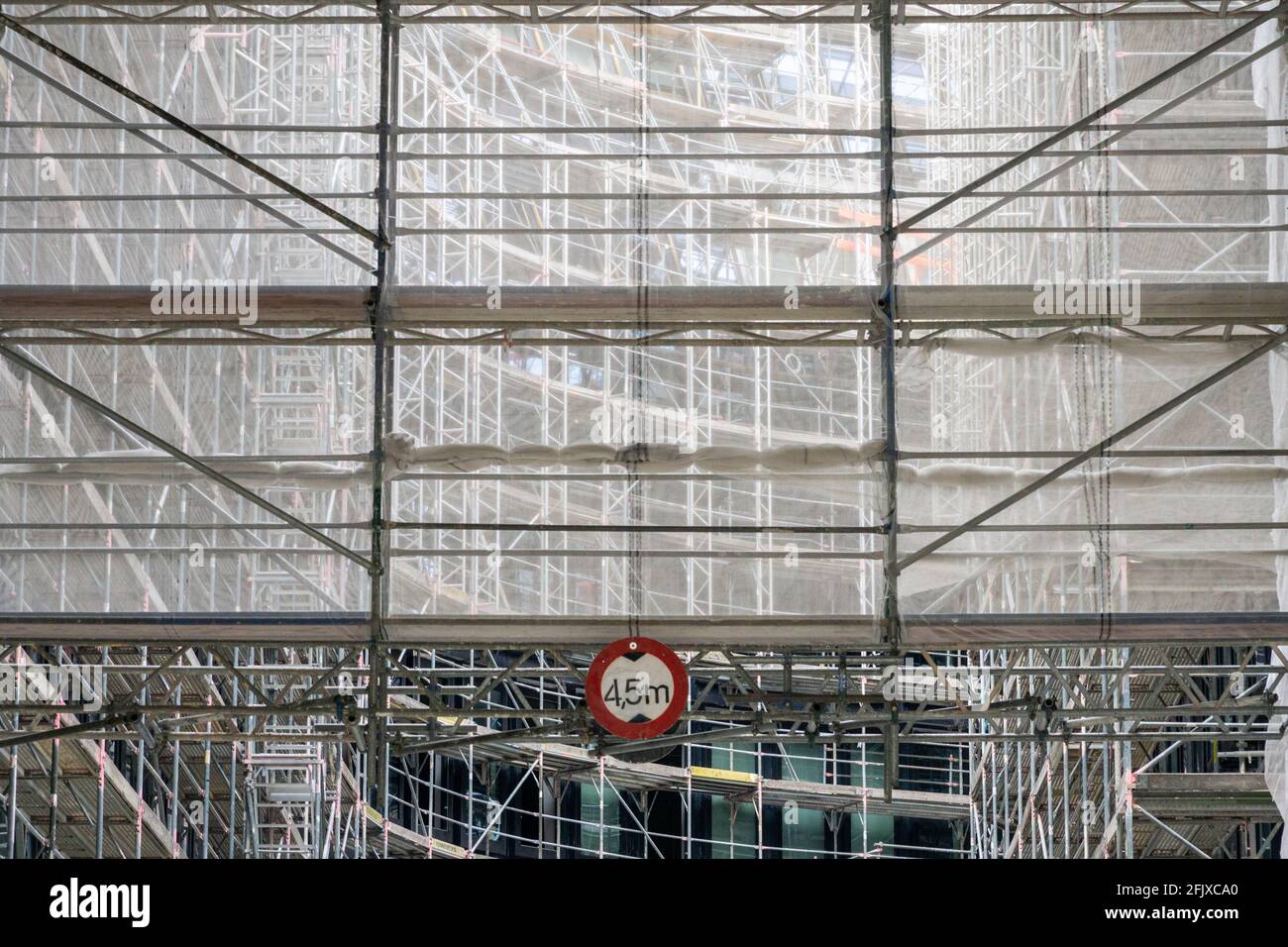 Area under construction with scaffolds around Stock Photo - Alamy
