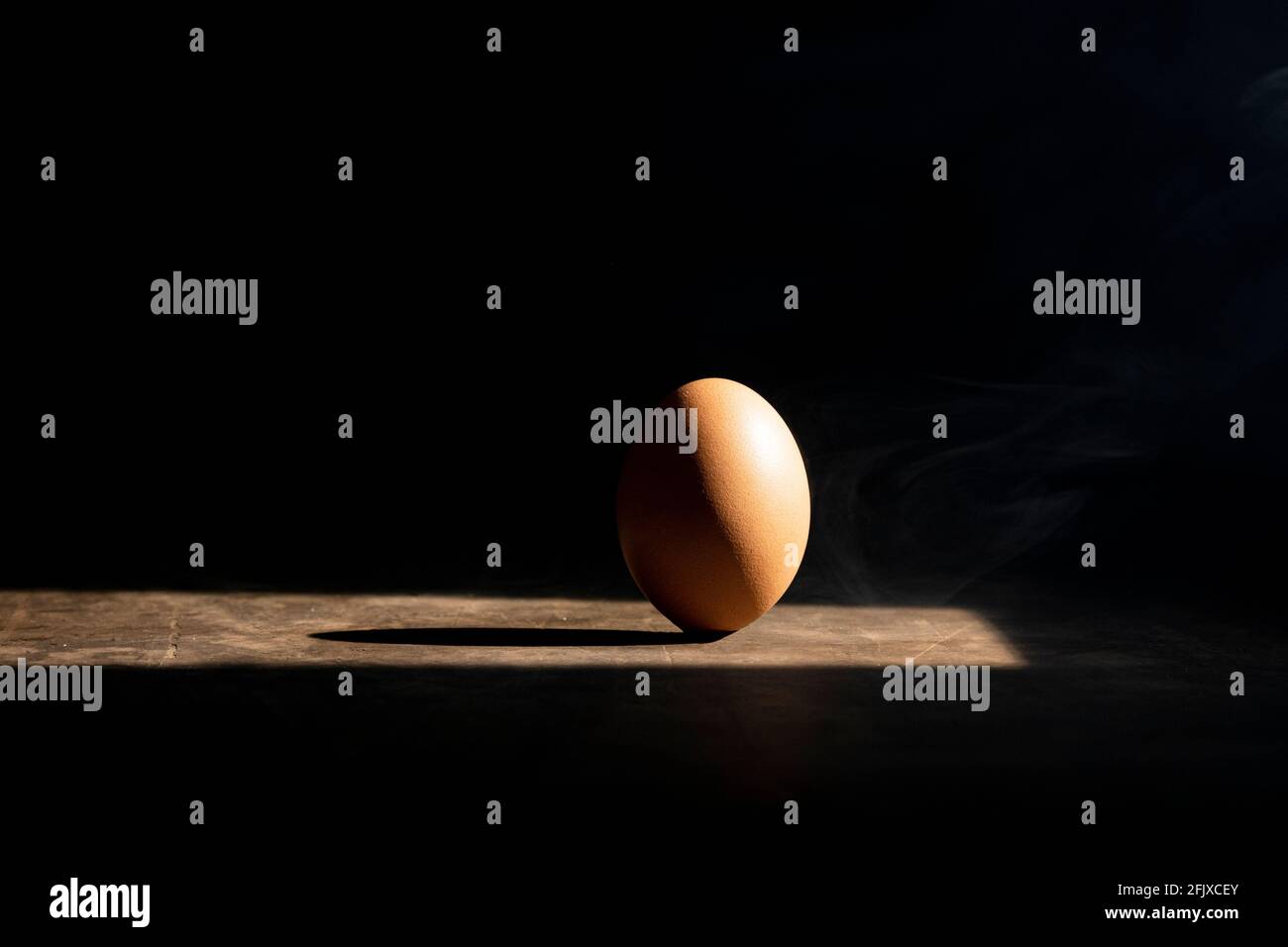 Egg with a strong light from a window Stock Photo - Alamy