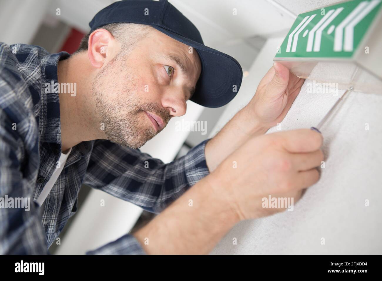 Installing signage hi-res stock photography and images - Alamy