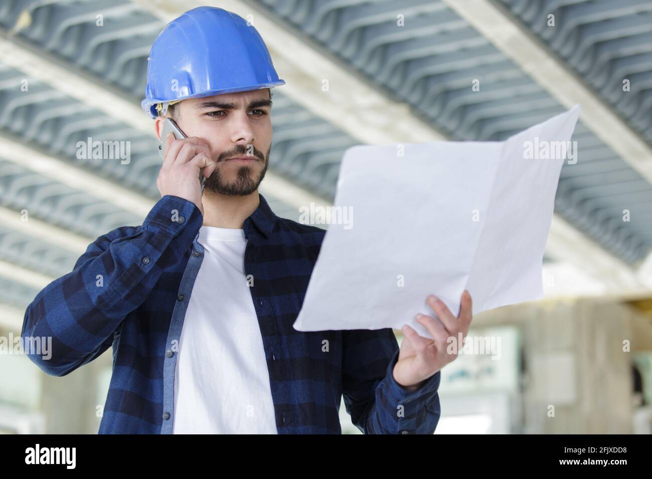 engineer talks on the phone in office Stock Photo - Alamy