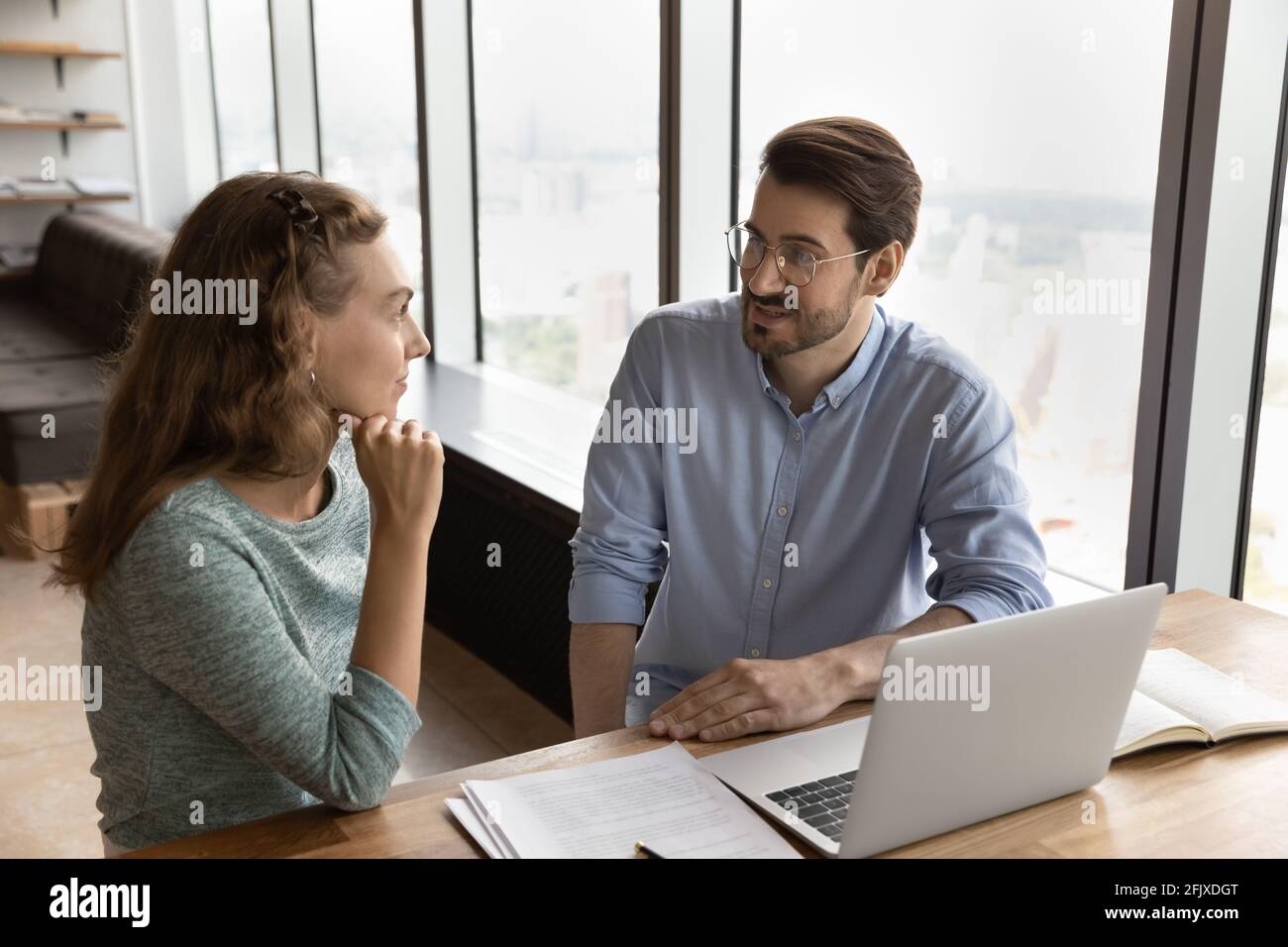 Happy diverse colleagues brainstorm working on computer Stock Photo - Alamy