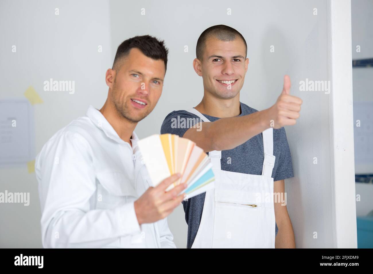painter man with color swatches in hand Stock Photo - Alamy