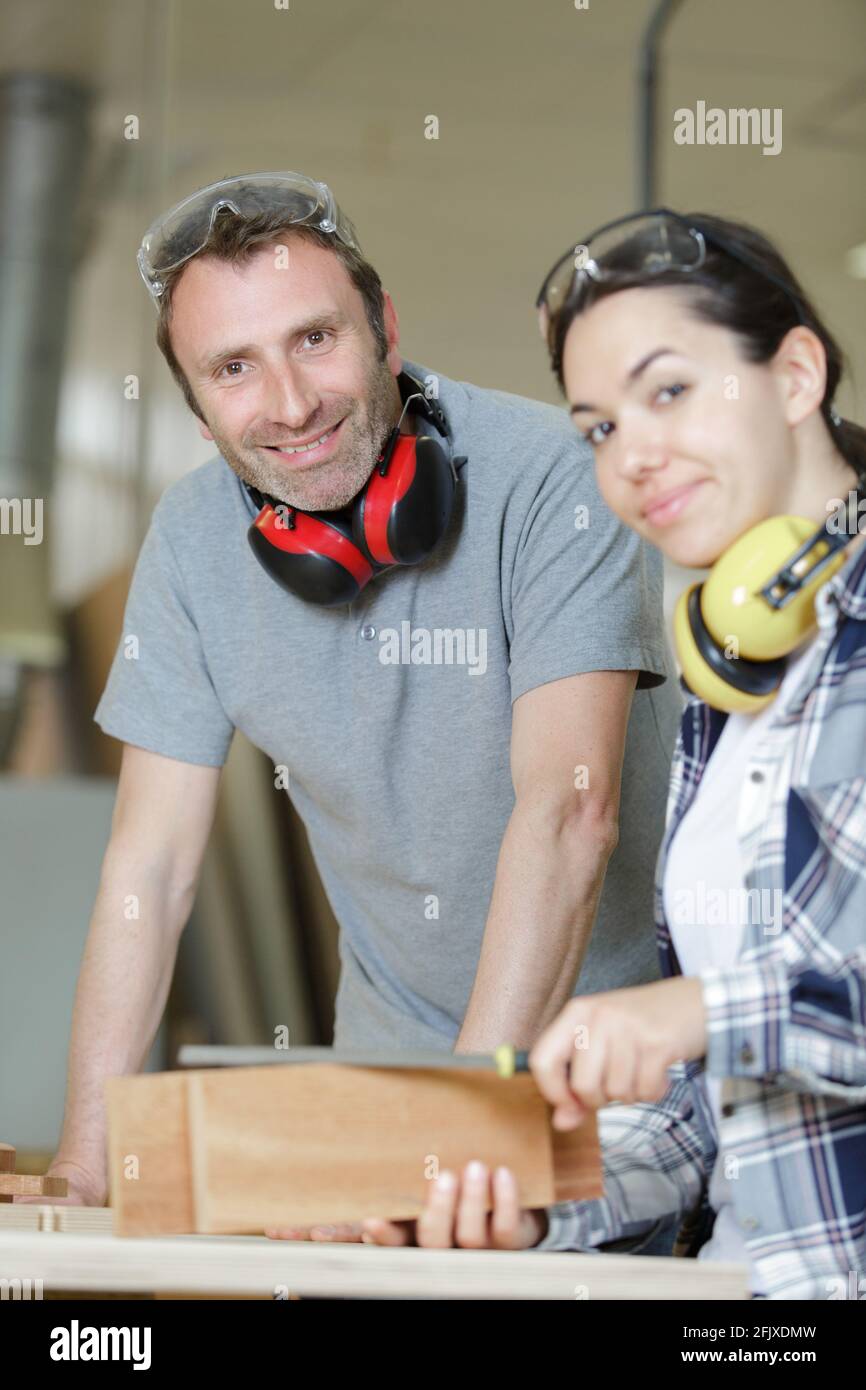 team of wood workers posing Stock Photo - Alamy