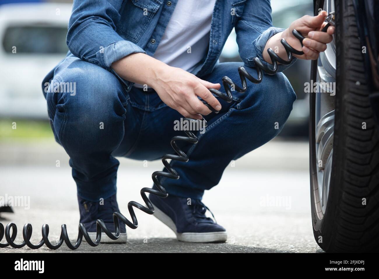 Man lifting the car hi-res stock photography and images - Alamy
