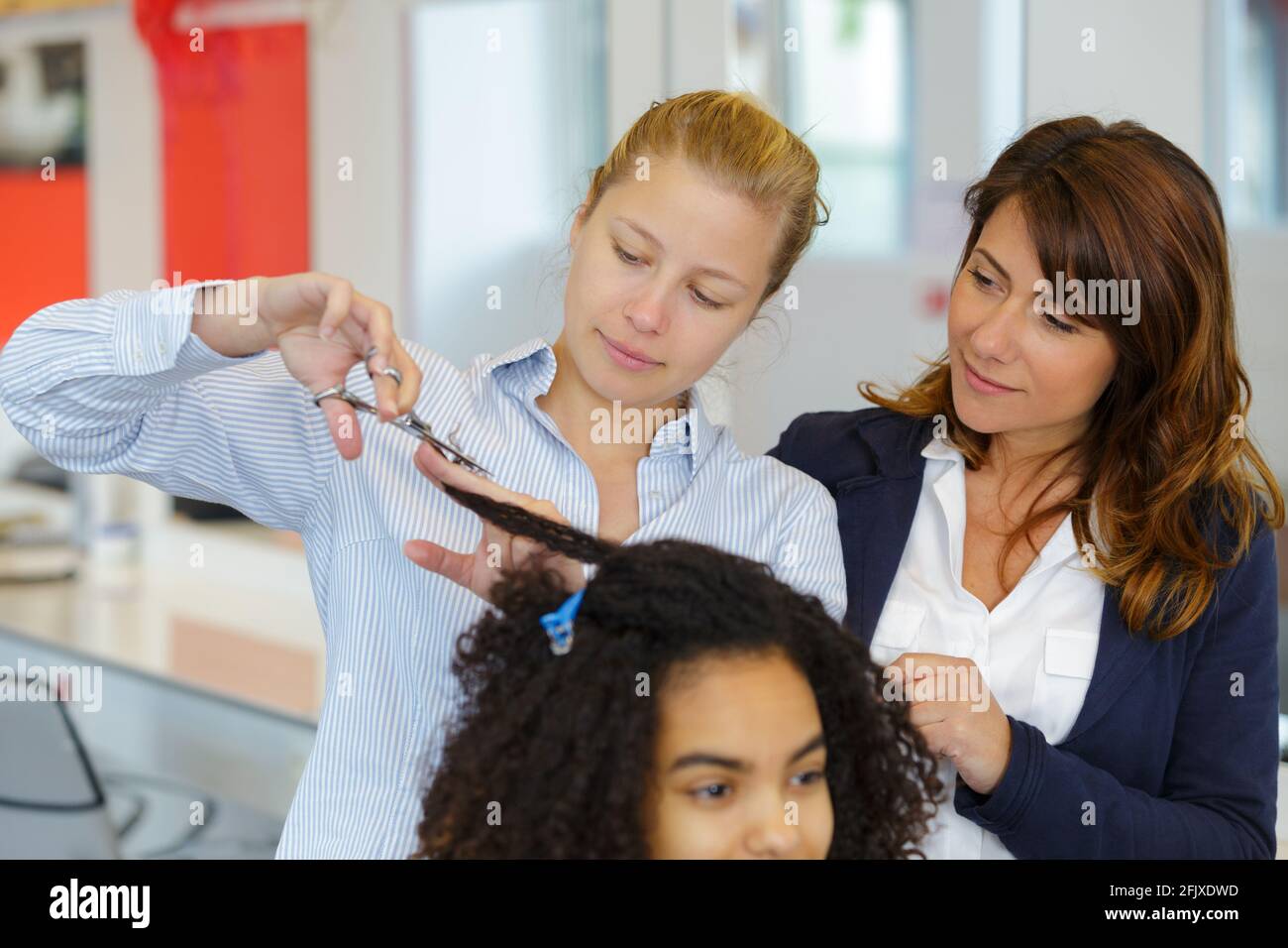 a hair salon apprentice concept Stock Photo - Alamy